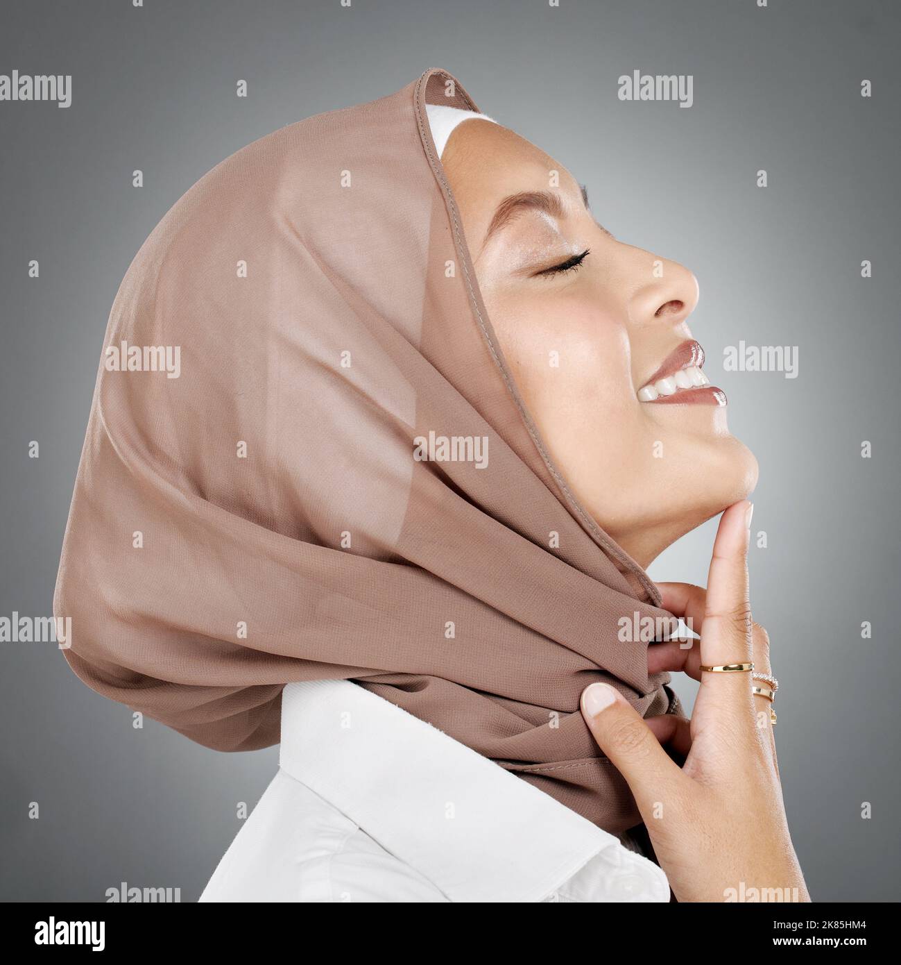 Face, beauty or skincare with a woman muslim wearing a hijab in studio ...
