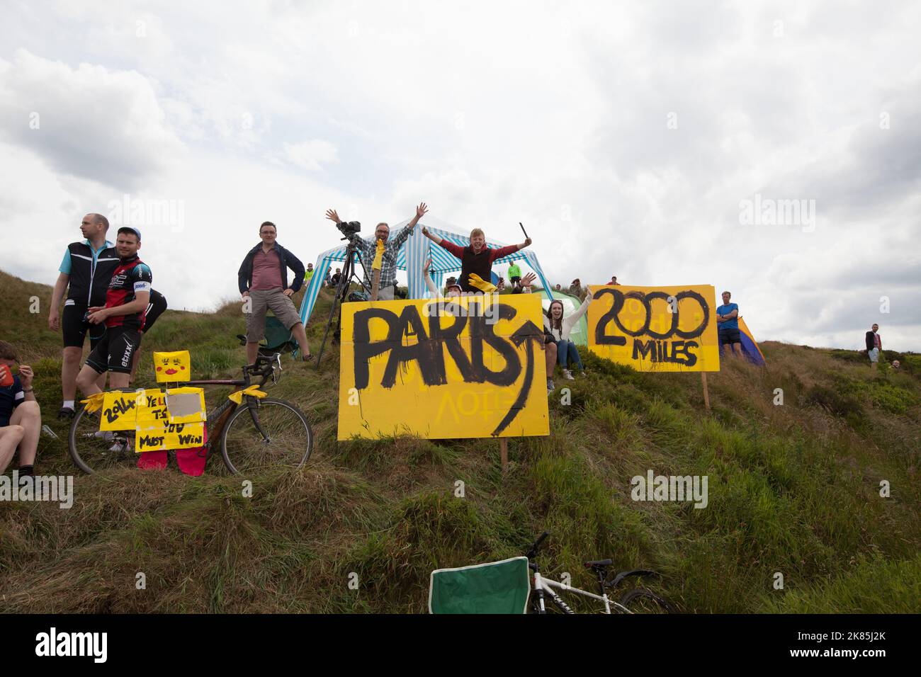 Excited fans line the route celebrating the Tour de France coming to ...