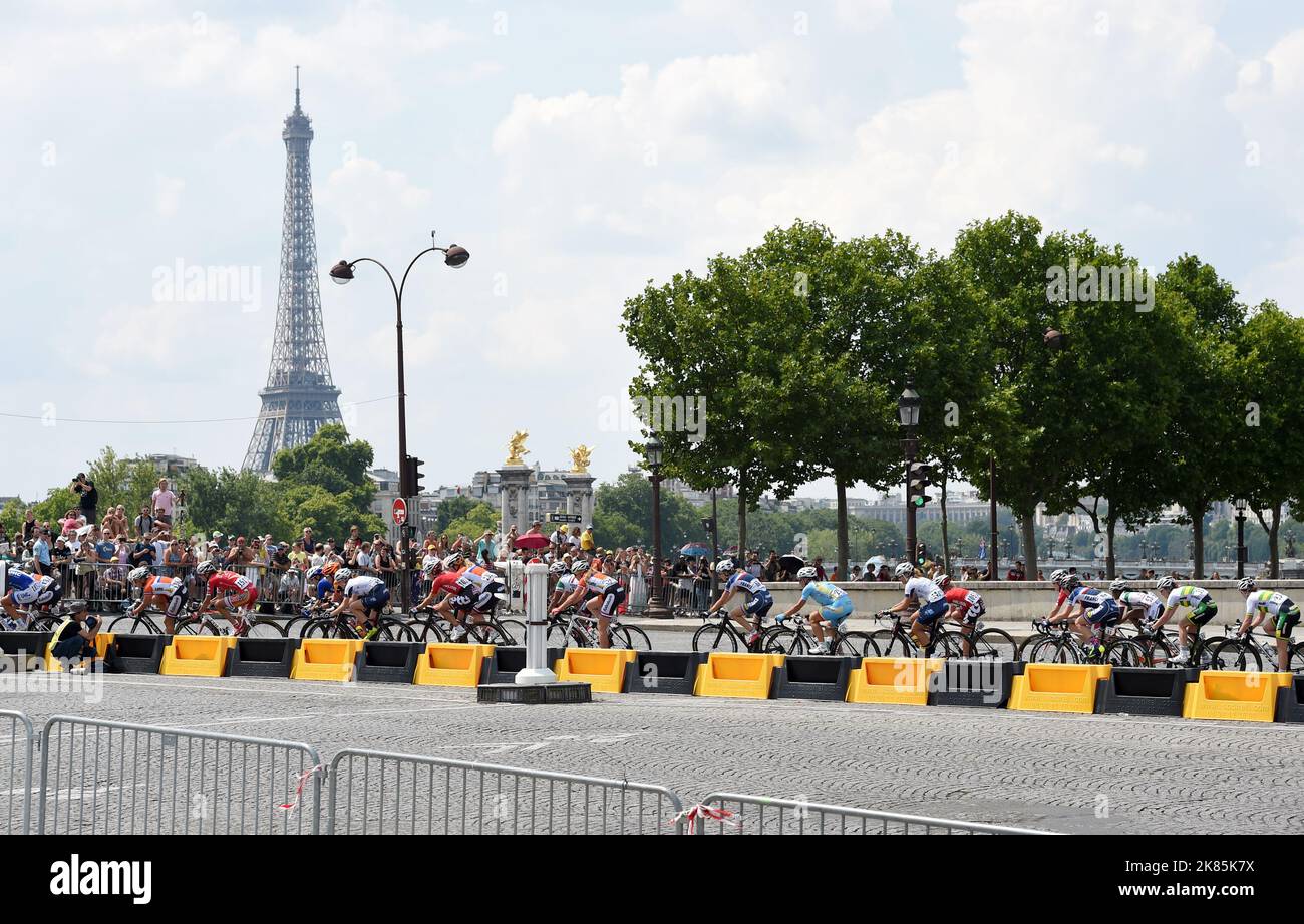 The Eiffel Tower can be seen in the background during the La Course ...