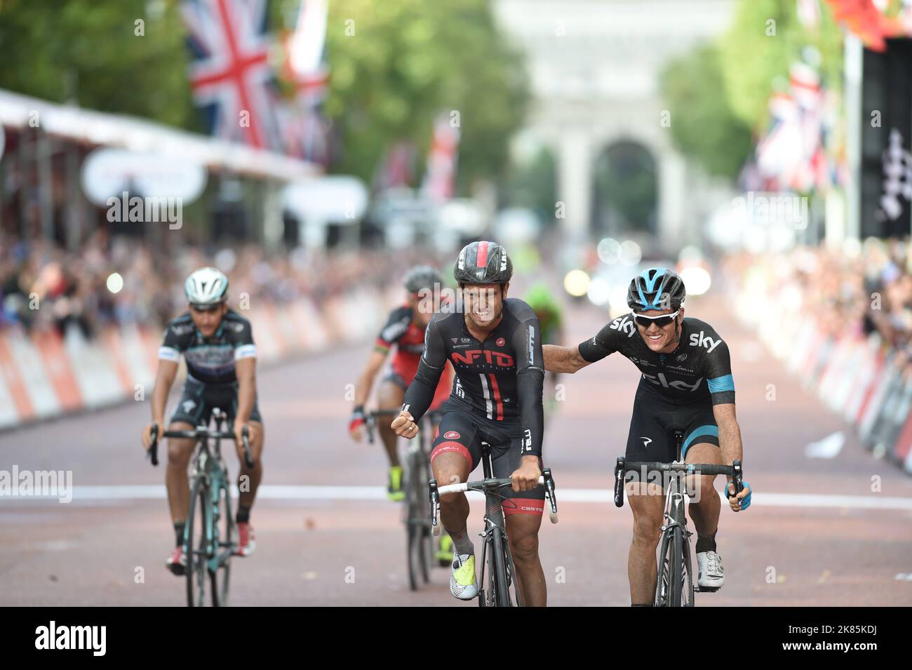 Adam Blythe team NFTO wins the race and is congratulated by Ben Swift ...