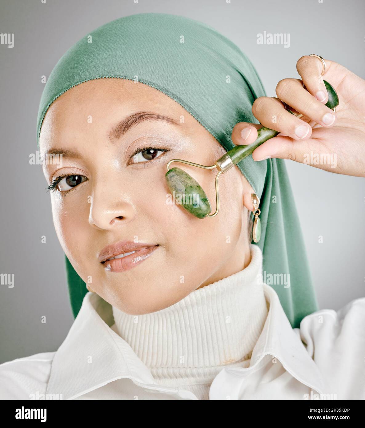 Muslim arab woman beauty, jade roller and facial skincare, cosmetics ...