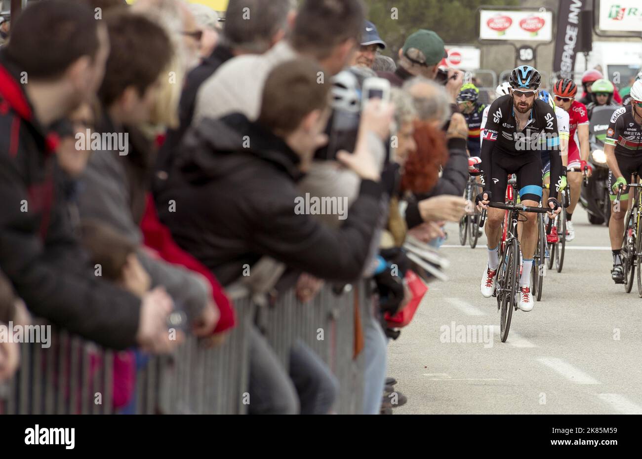 Team Sky's Sir Bradley Wiggins rides over the finish line in ...