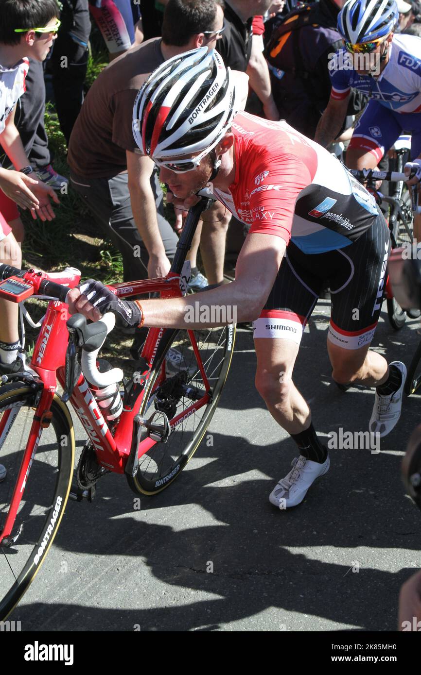 Frank Schleck, Team Trek Factory Racing, walks his bike up the Alto De ...