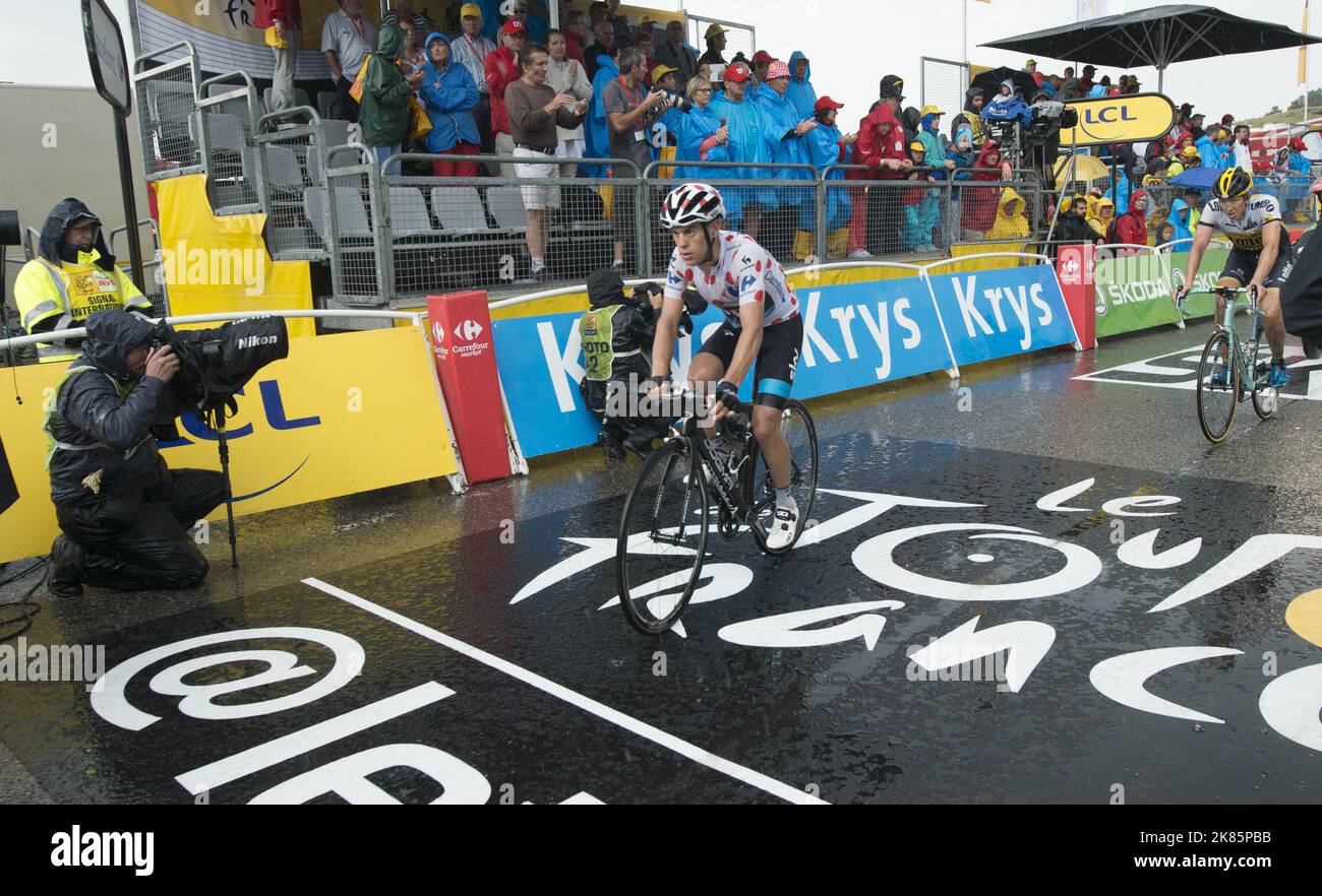 Richie Porte, team Sky, crosses the finish line wearing the polka dot ...