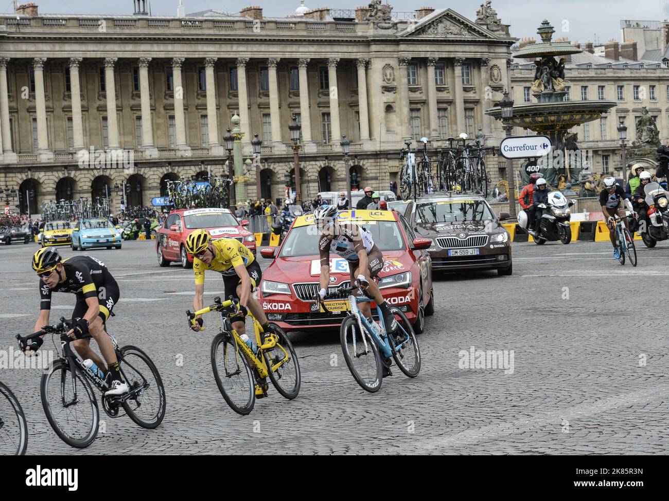 Team Sky's Chris Froome cycles with teammate Luke Rowe and Team AGR2 La ...