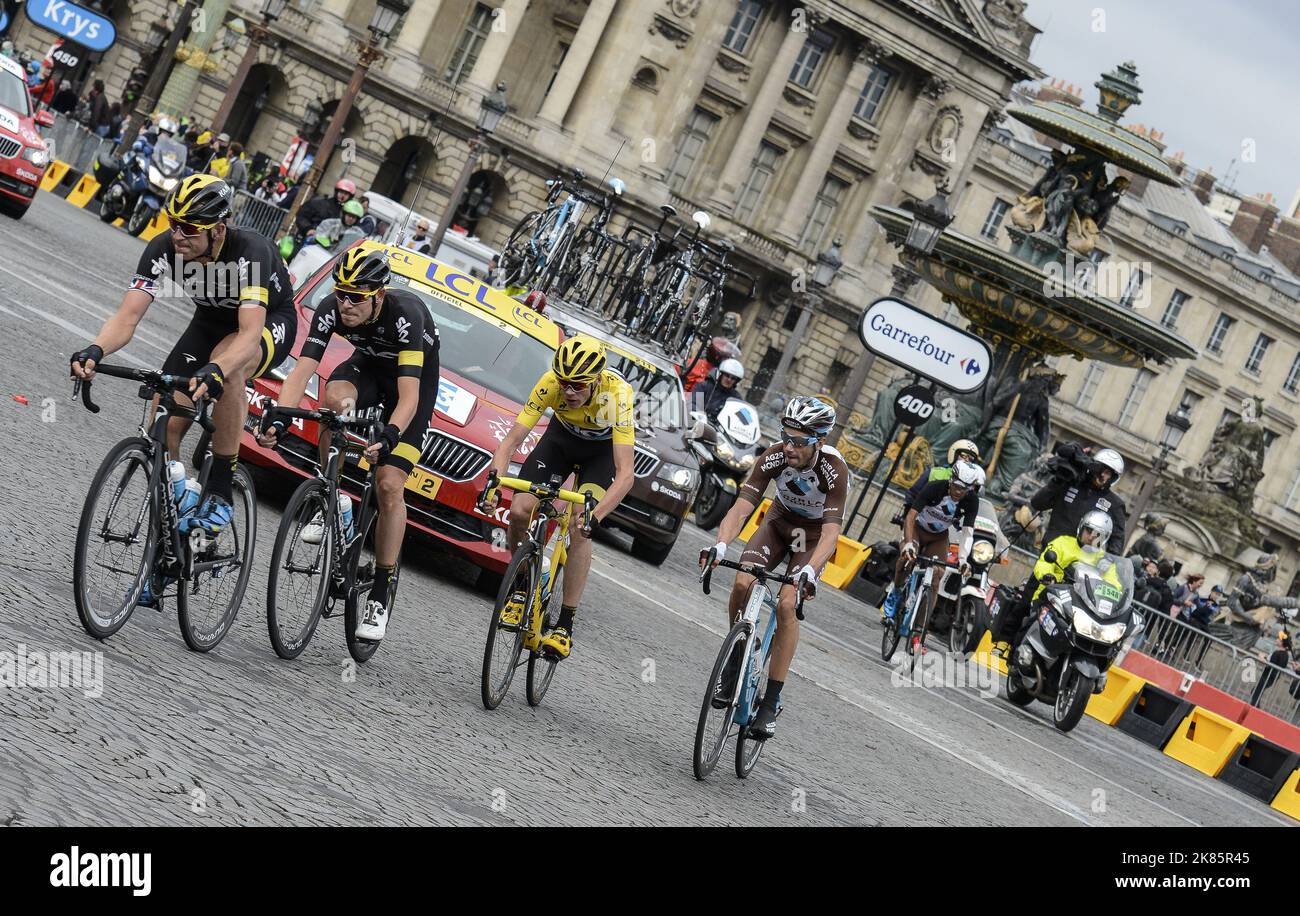 Team Sky's Chris Froome cycles with teammate Luke Rowe and Team AGR2 La ...