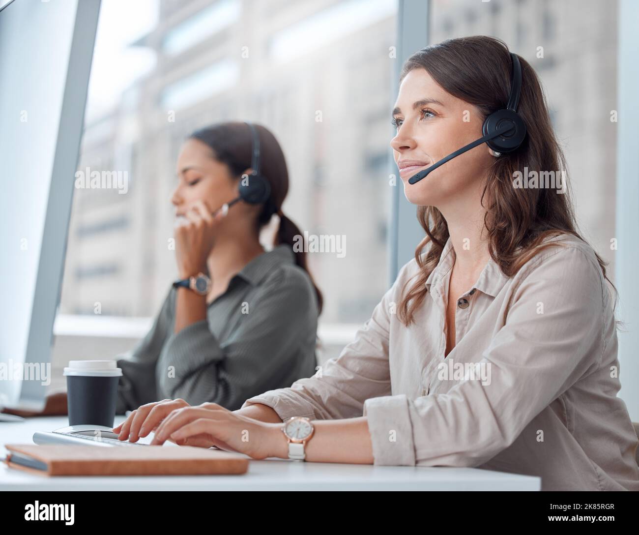 Today has been such a good day. two young female call center workers in ...