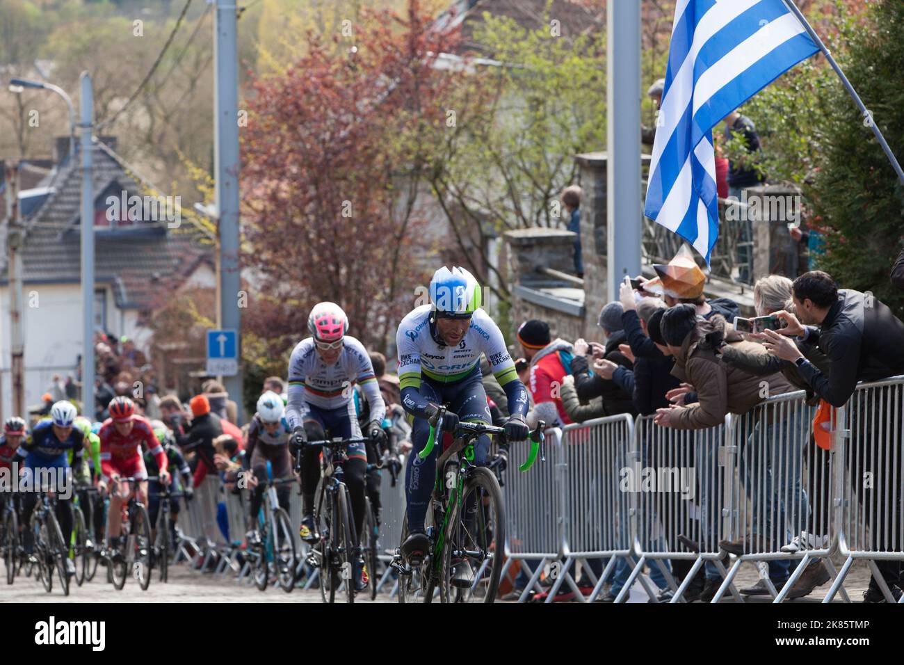 Michael Albasini, (Orica Greenedge) leads the race up the cobbles Stock ...