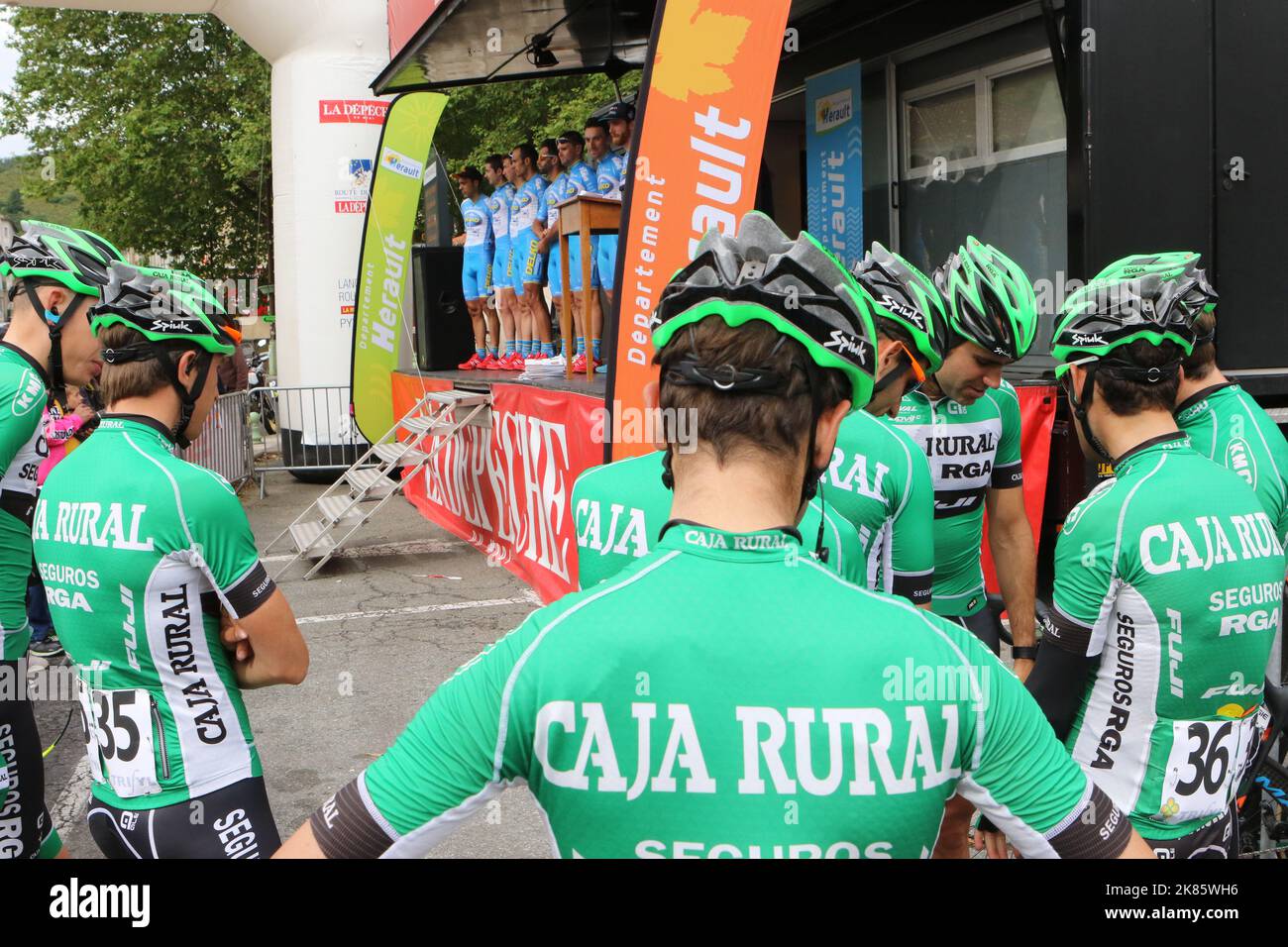 Team Caja Rural waiting for the podium Stock Photo - Alamy