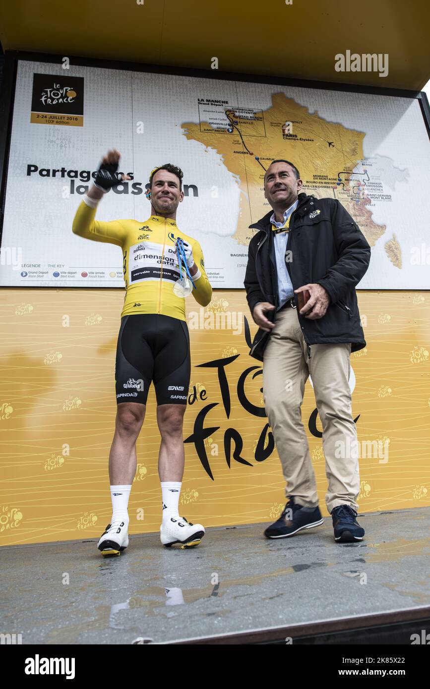 Mark Cavendish team Dimension Data arrives on stage and is handed a ...