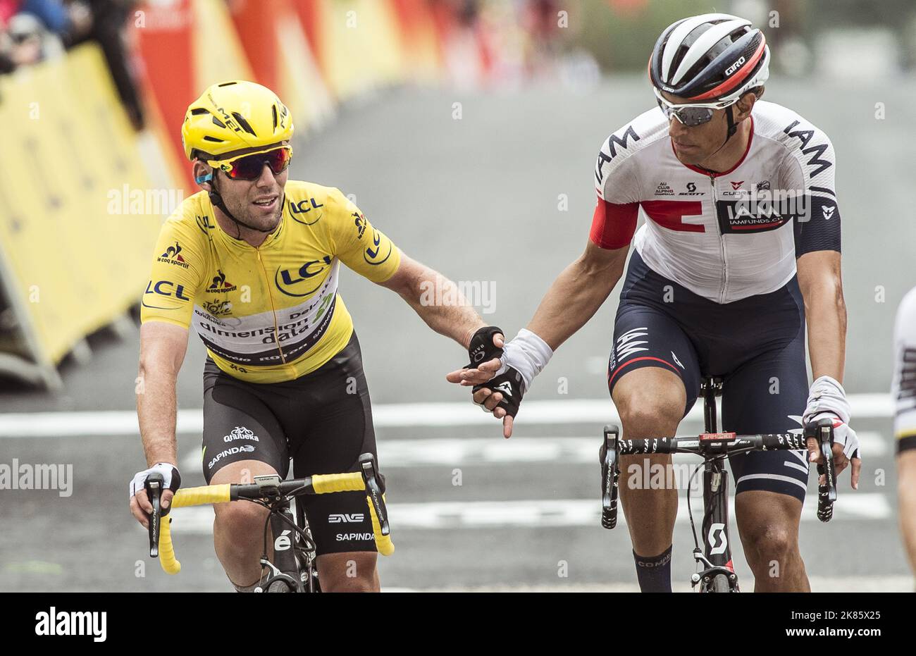 Mark Cavendish team Dimension Data crosses the finish line and ...