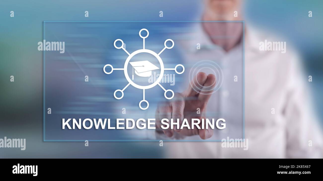 Man touching a knowledge sharing concept on a touch screen with his ...