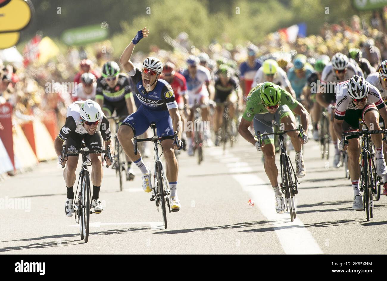 Mark Cavendish (GB) of Team Dimension Data wins the stage in a sprint ...