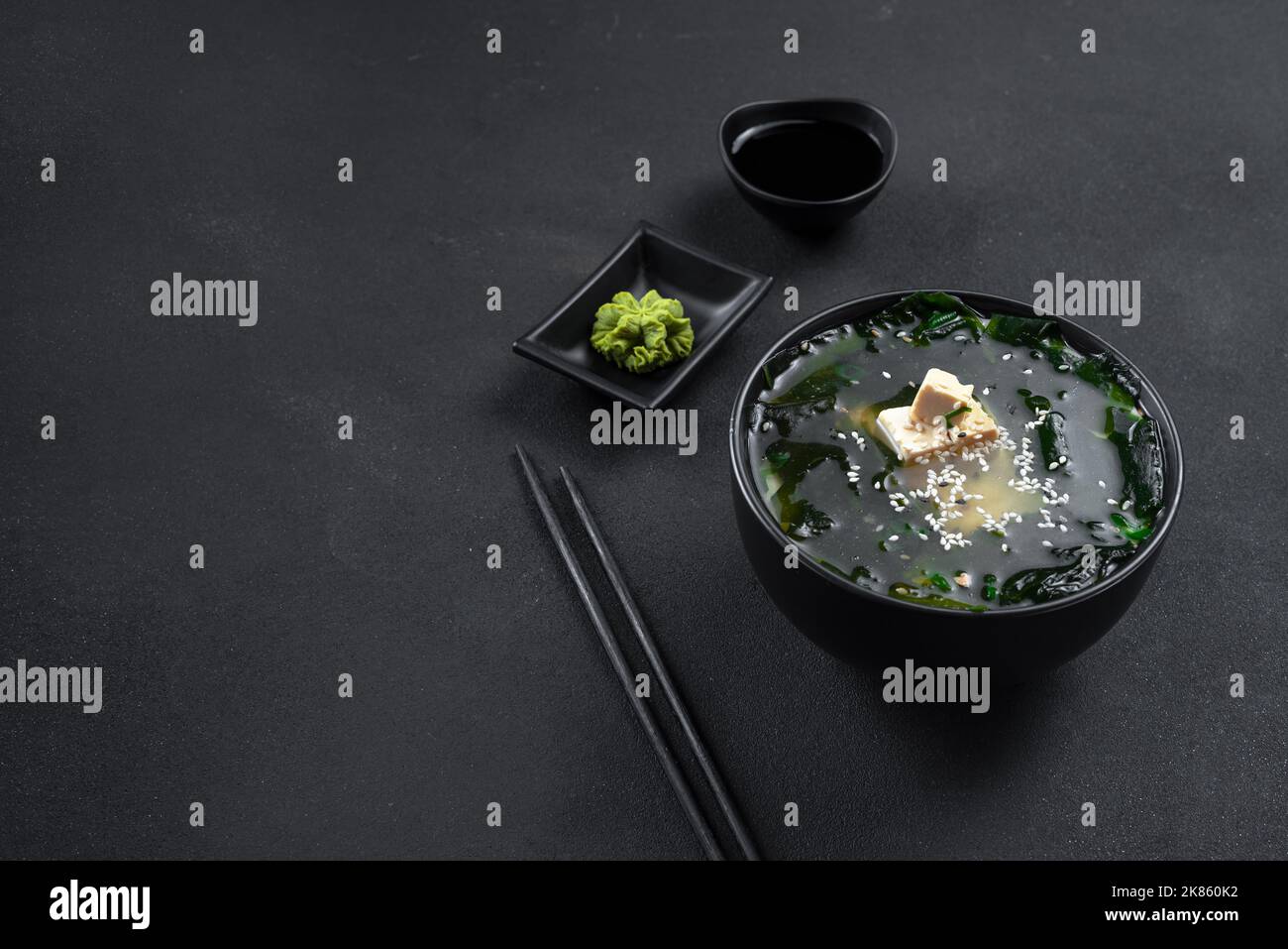 Miso soup. Traditional Asian soup on a black background Stock Photo - Alamy