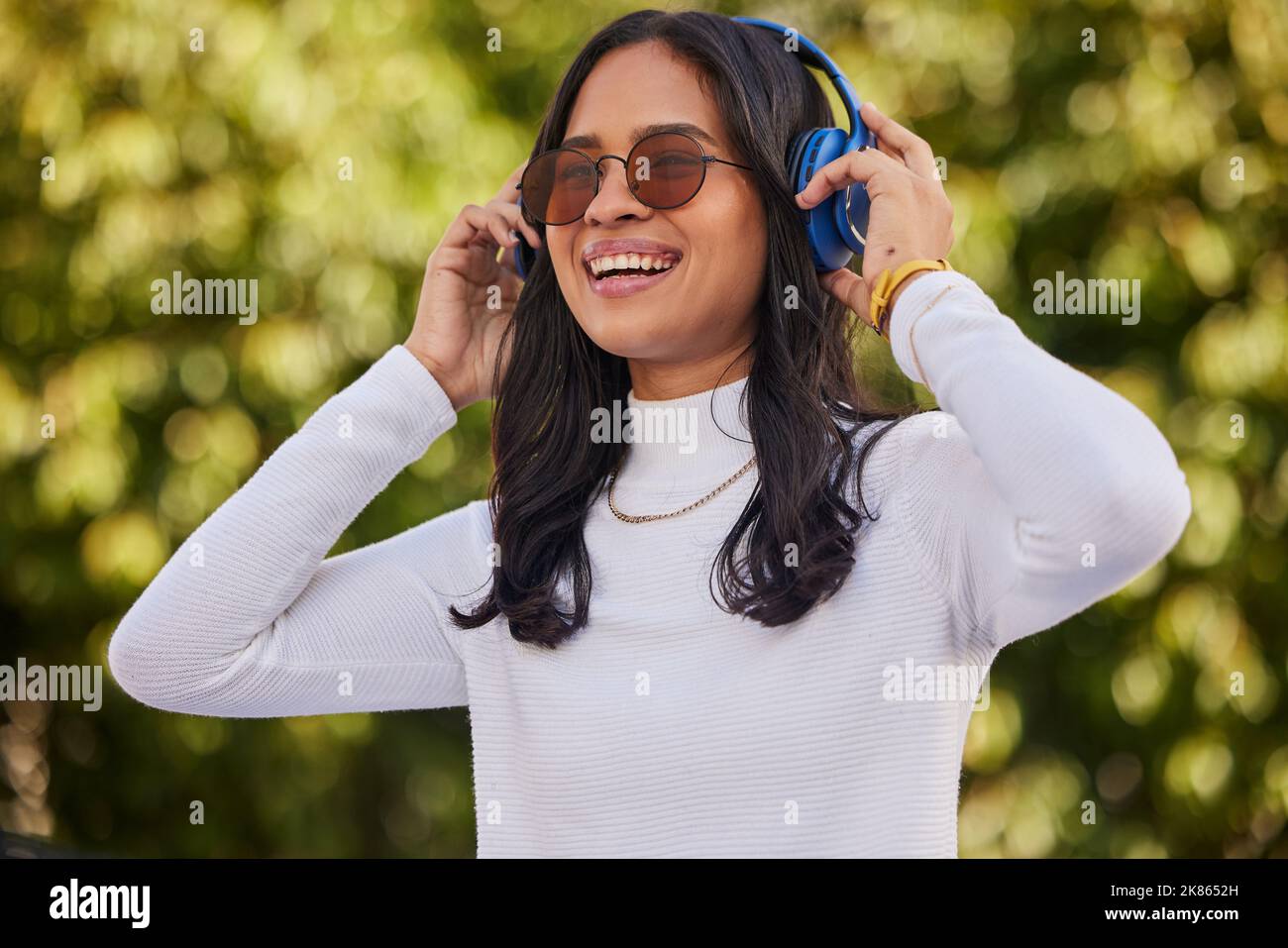 Happy, woman and headphones listening to music for fun online audio ...