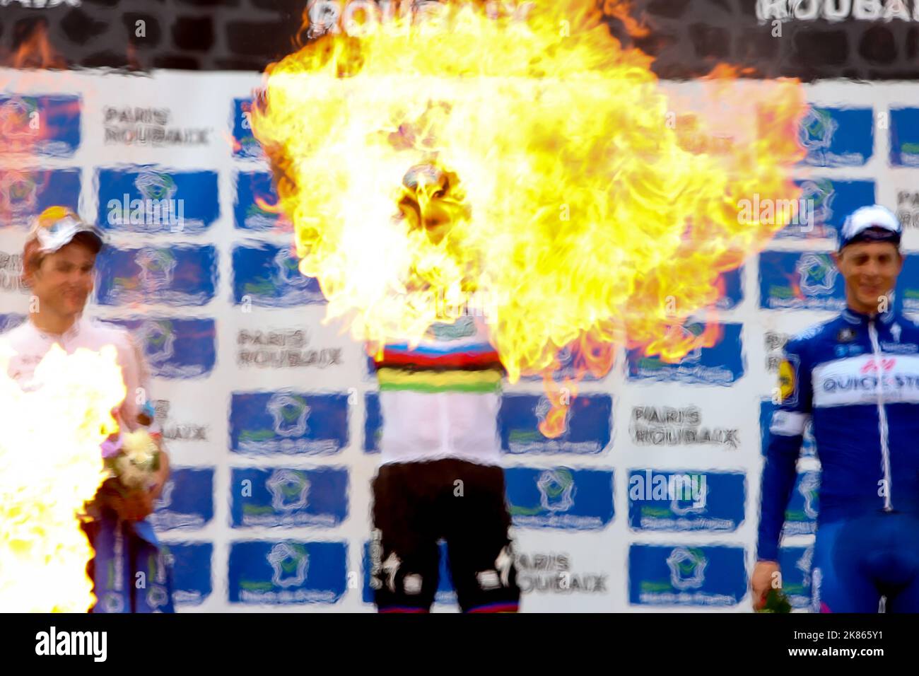 World Champion Peter Sagan (Bora Hansgrohe) masked by the pyrotechnics ...