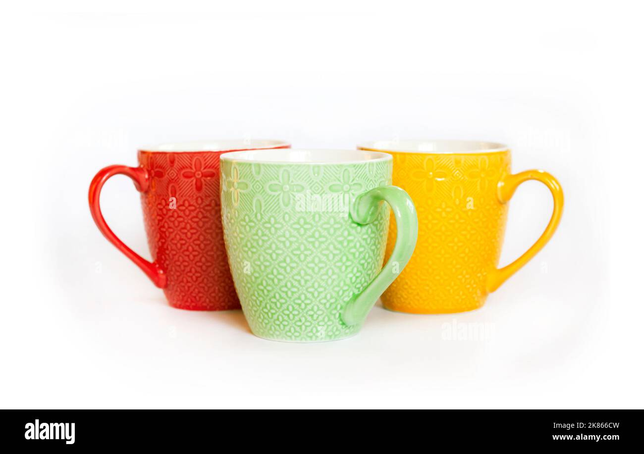 Colorful mugs isolated on white background Stock Photo - Alamy