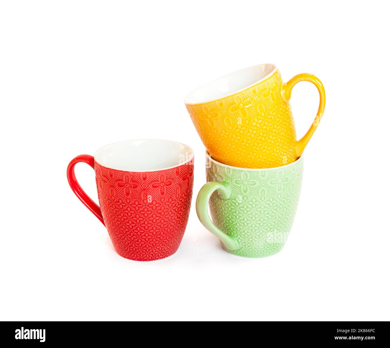 Three colorful mugs isolated on white background with clipping path ...