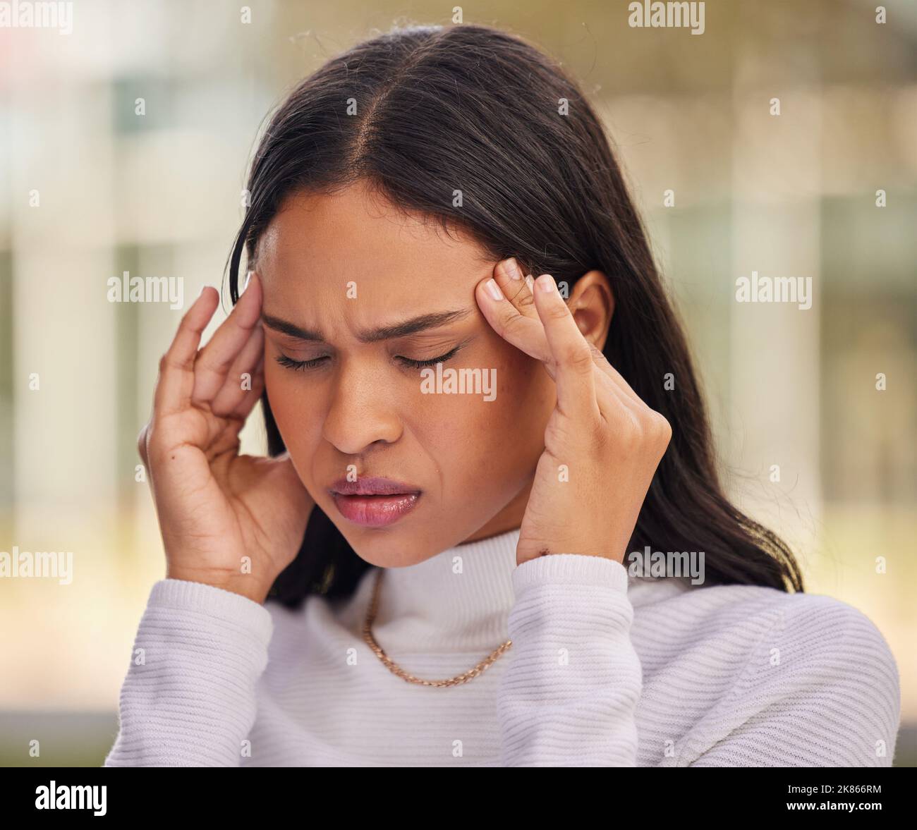 Woman, face and stress headache in city from startup, creative company ...