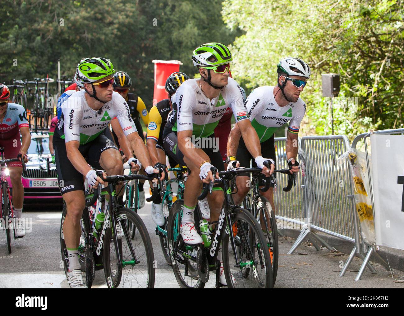 Mark Cavendish is escorted up the final climb by his Team Dimension ...