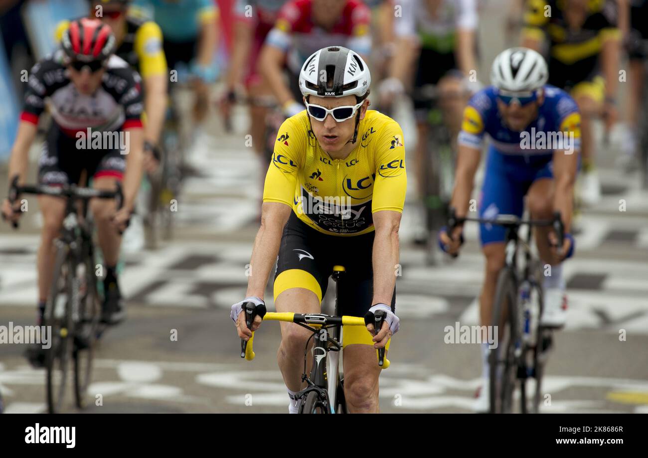 Great Britain's Geraint Thomas crosses the finish line and retains his ...