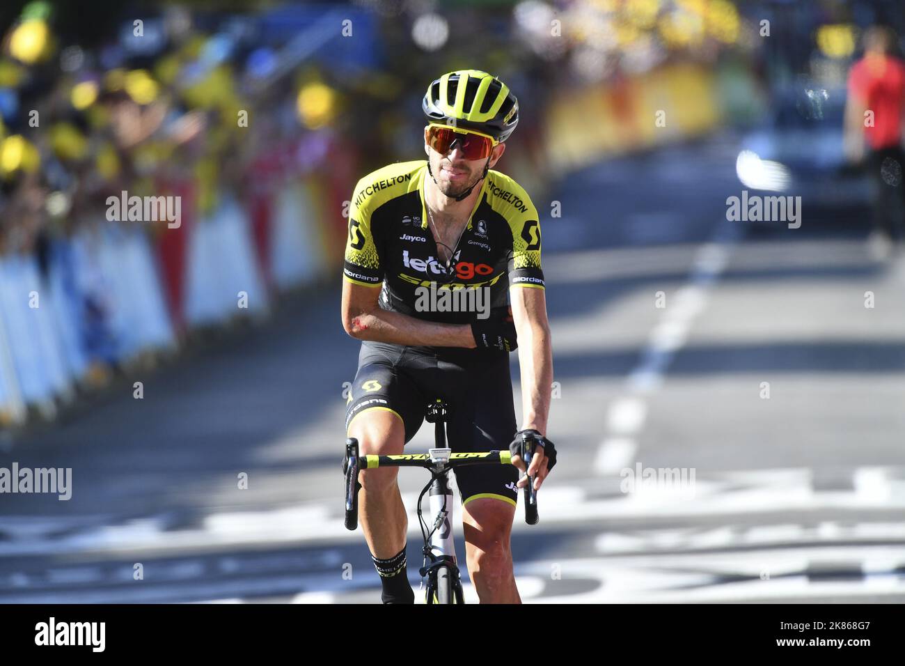 Damien Howson of Mitchelton Scott shows damage from the crash at 500m ...