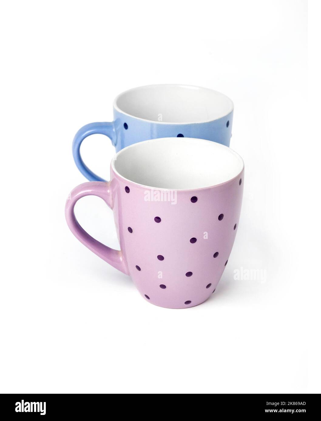 Pink and blue dotted teacups isolated on white background Stock Photo ...