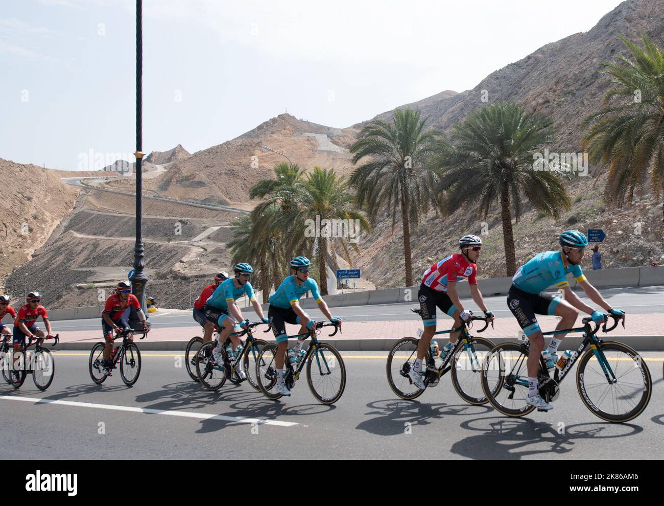 Race leader Alexey Lutsenko for team Astana rides amongst the peloton ...