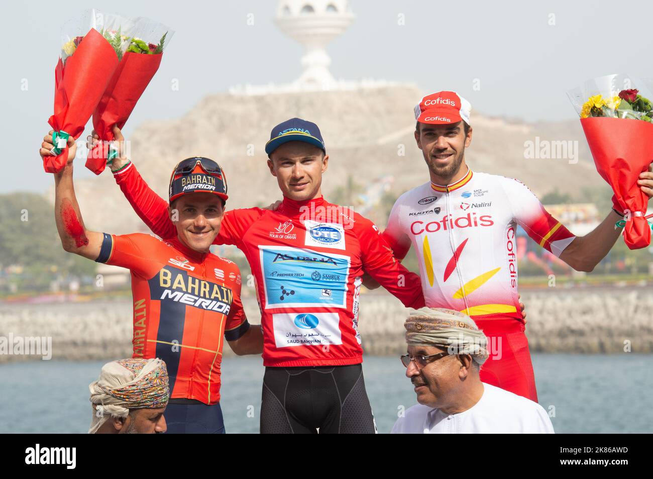 Overall winner Alexey Lutsenko stands on the podium with second place ...