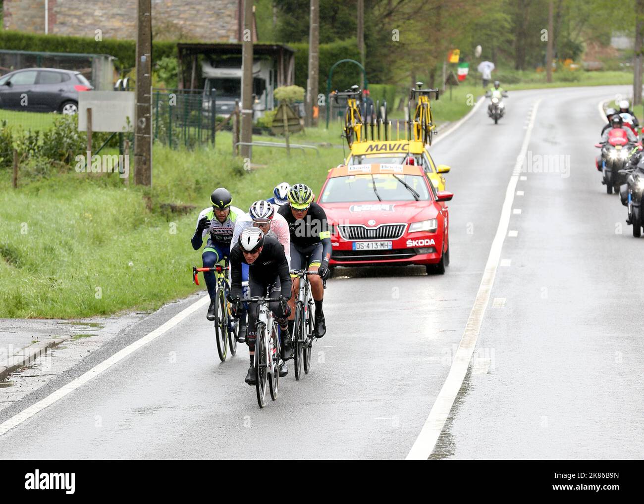 Riders in action in the early breakaway roll down into the Valley of ...