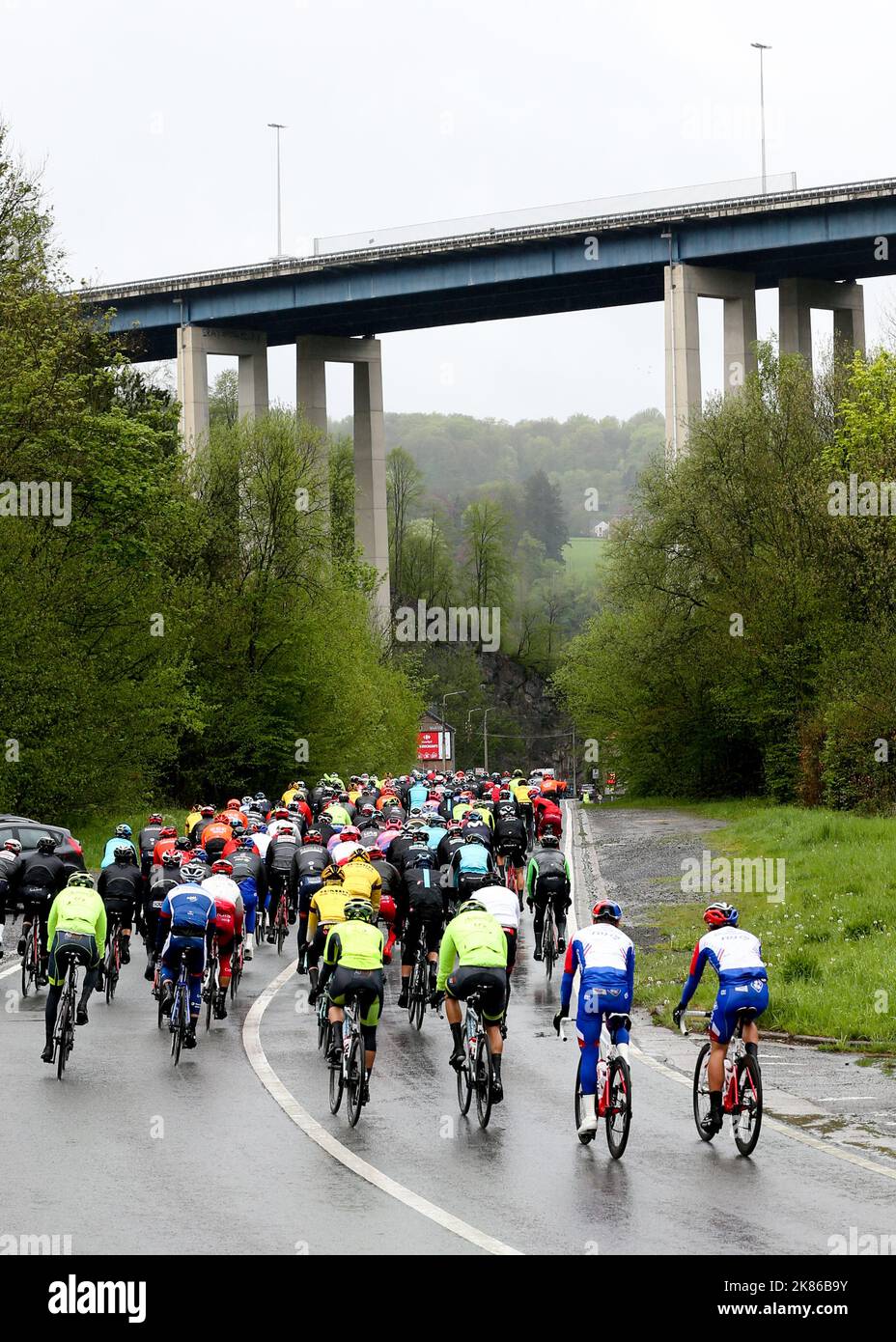 Riders head down into the Remouchamps valley as cross over the return ...