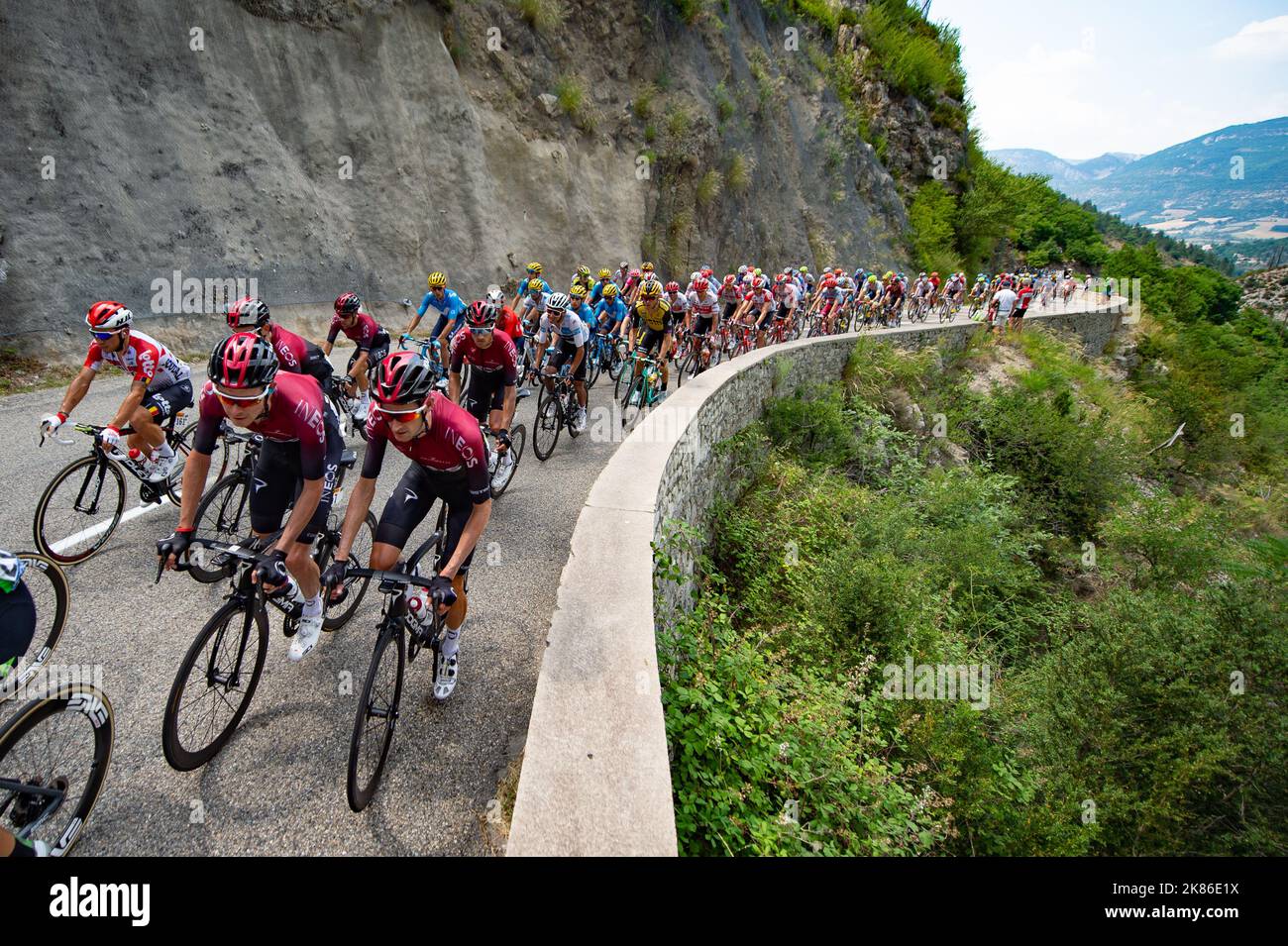 The peloton ride over the first climb with the Ineos team and last year ...