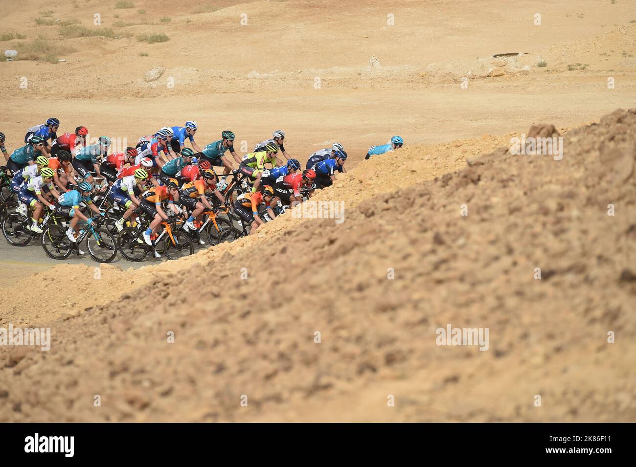 The chasing Peloton lead by the UAE Team Emirates riding though the ...