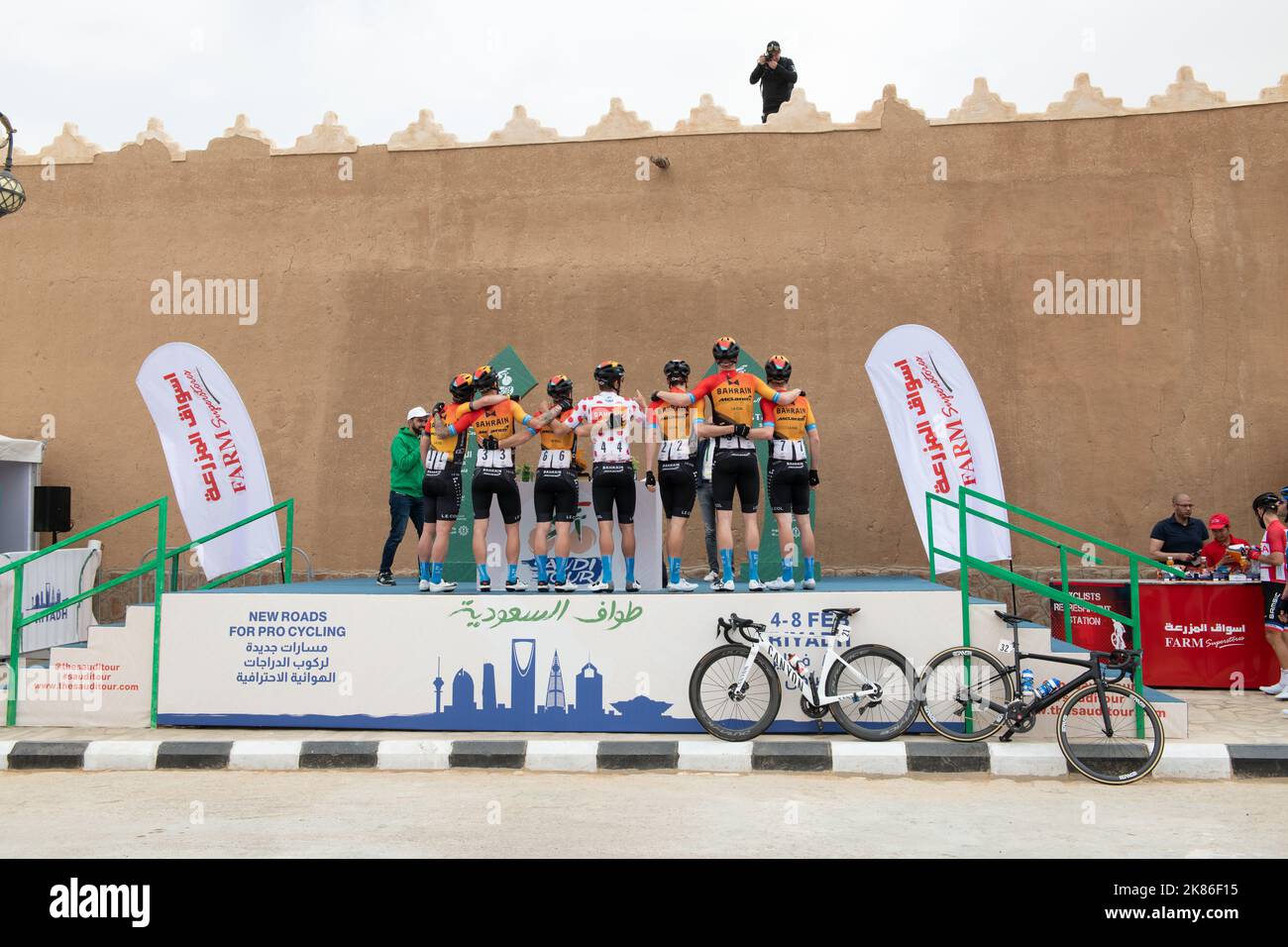 The Bahrain McLaren team stand and pose for a photograph from above on ...