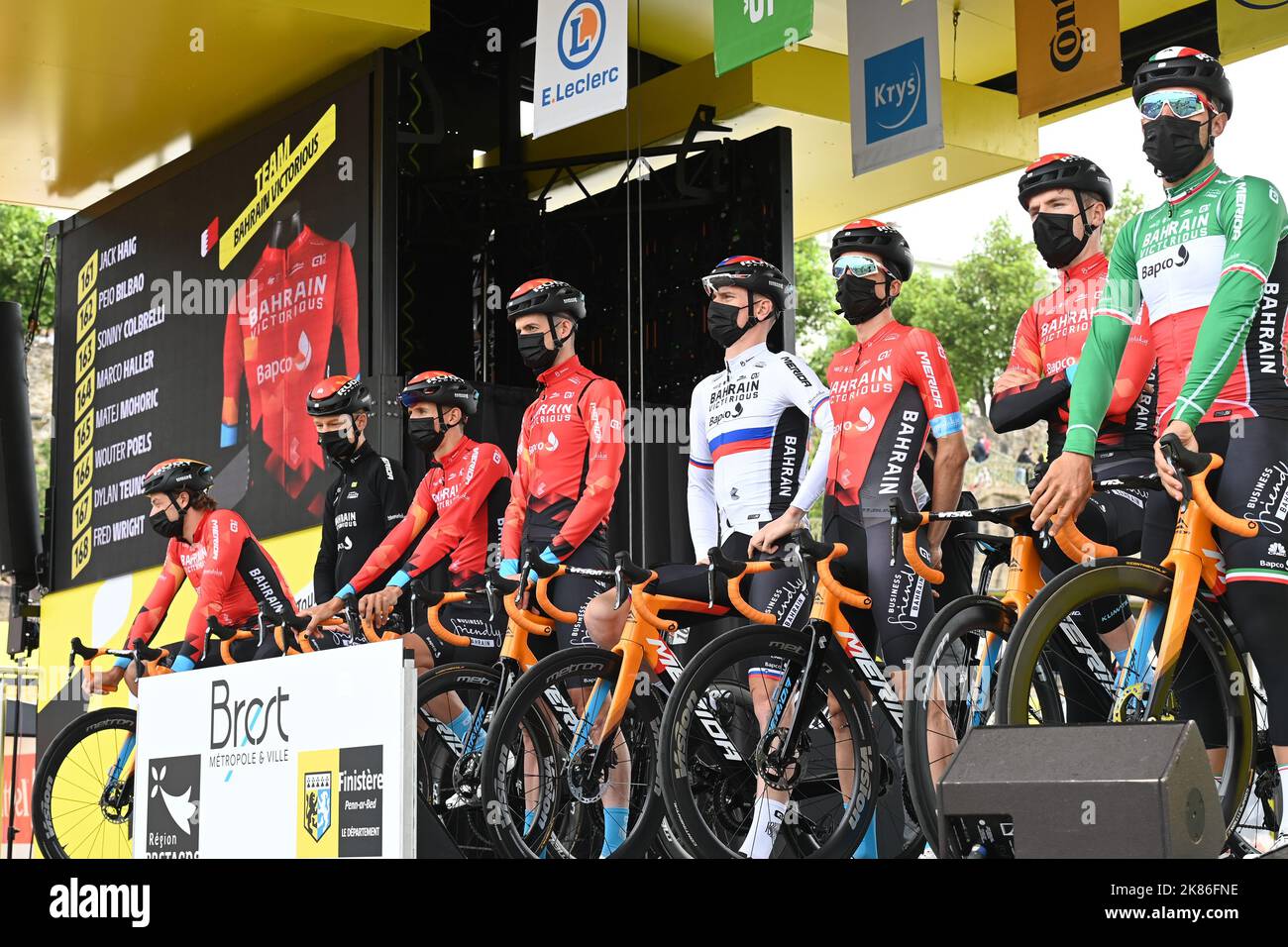 Team Bahrain Victorious line up on the podium at the start. of the race ...