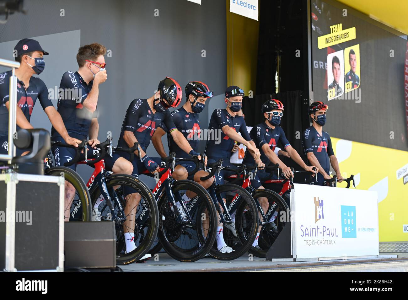 Ineos Grenadiers team line up on the starting podium during stage 12 of ...