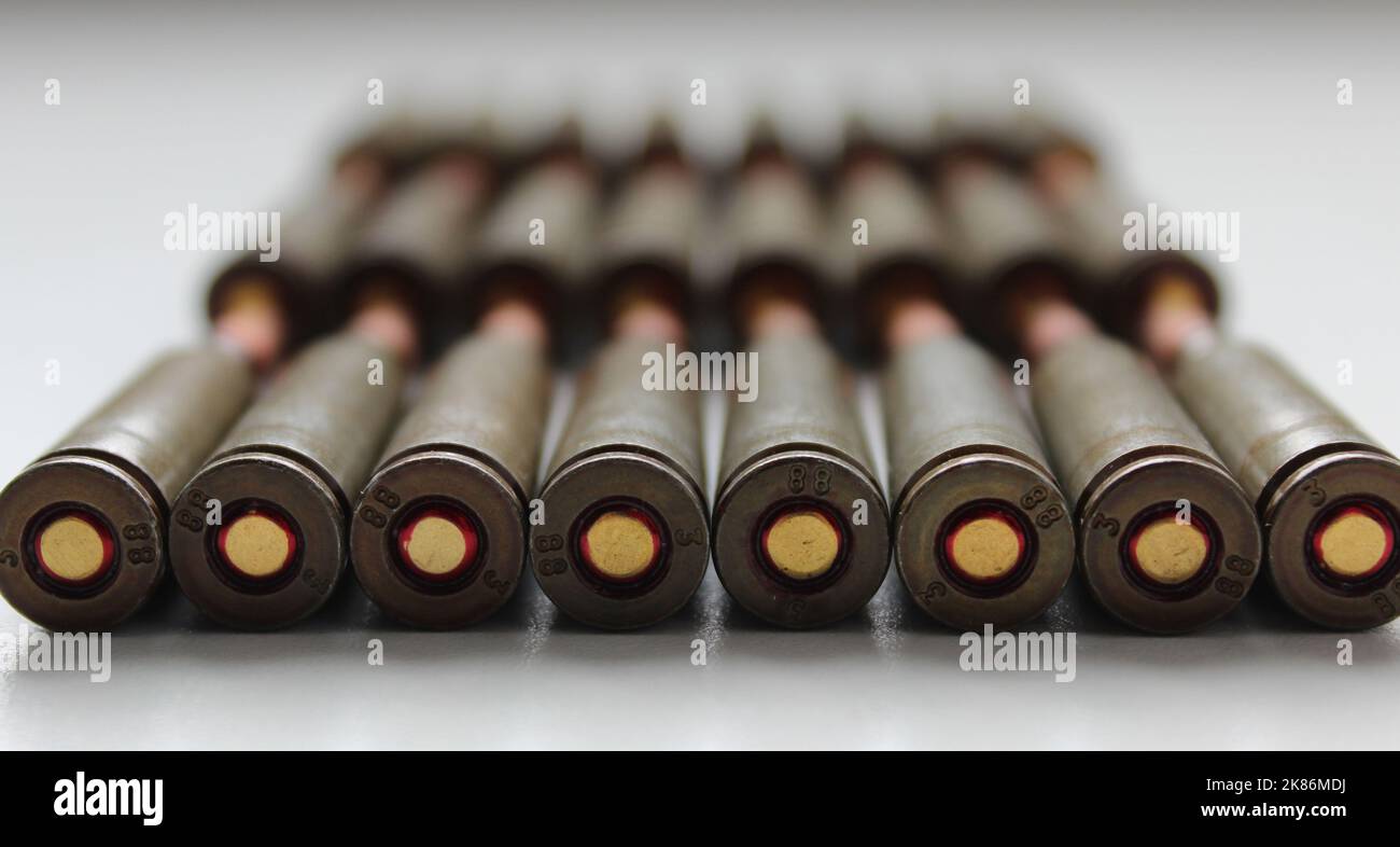 Macro Shot Of A Rows Of Live Ammunition Capsules Laid Out In Order On ...