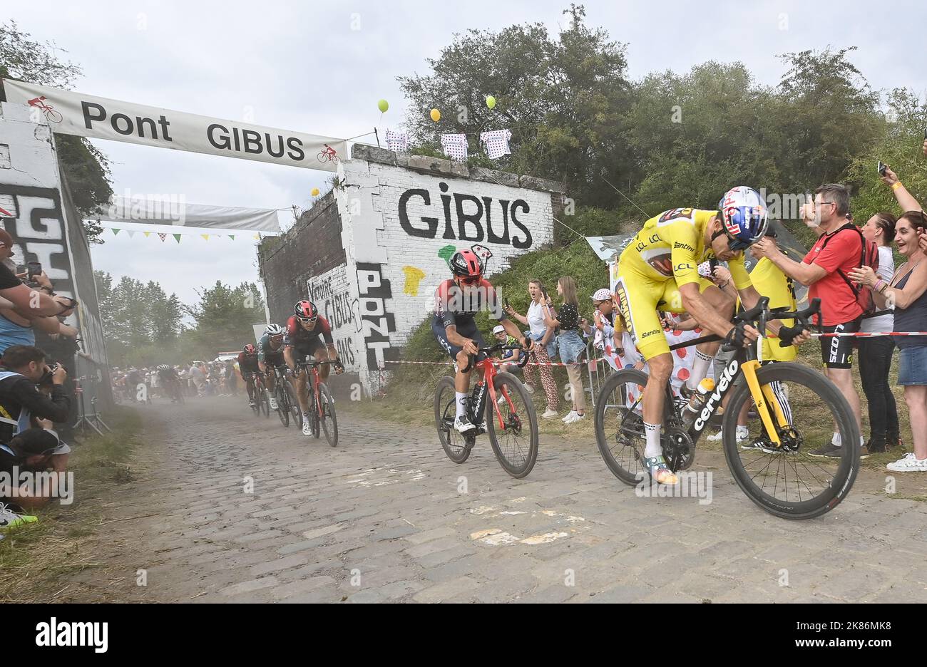 Wout Van Aert for team Jumbo Visma ride the cobbles of Pont Gibus in ...