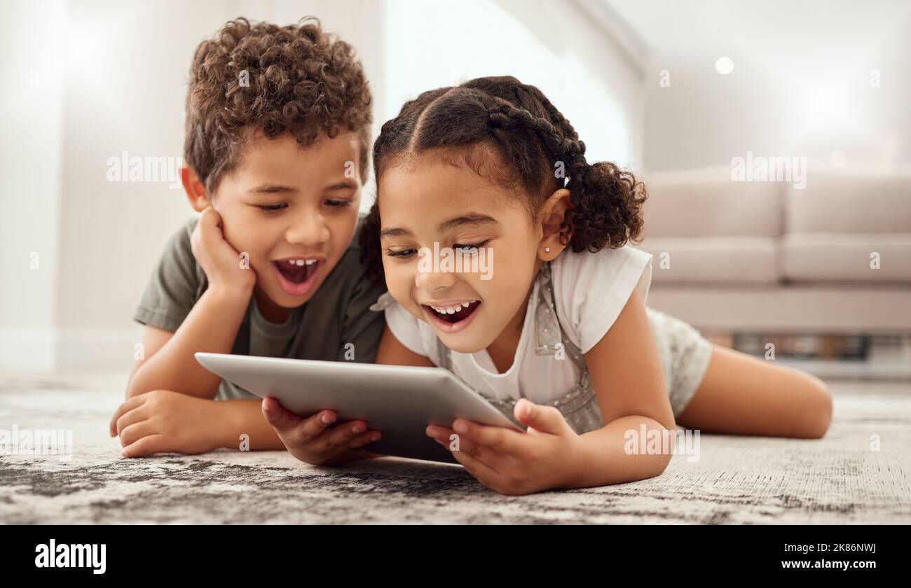 Tablet, children and family with a brother and sister watching movies ...