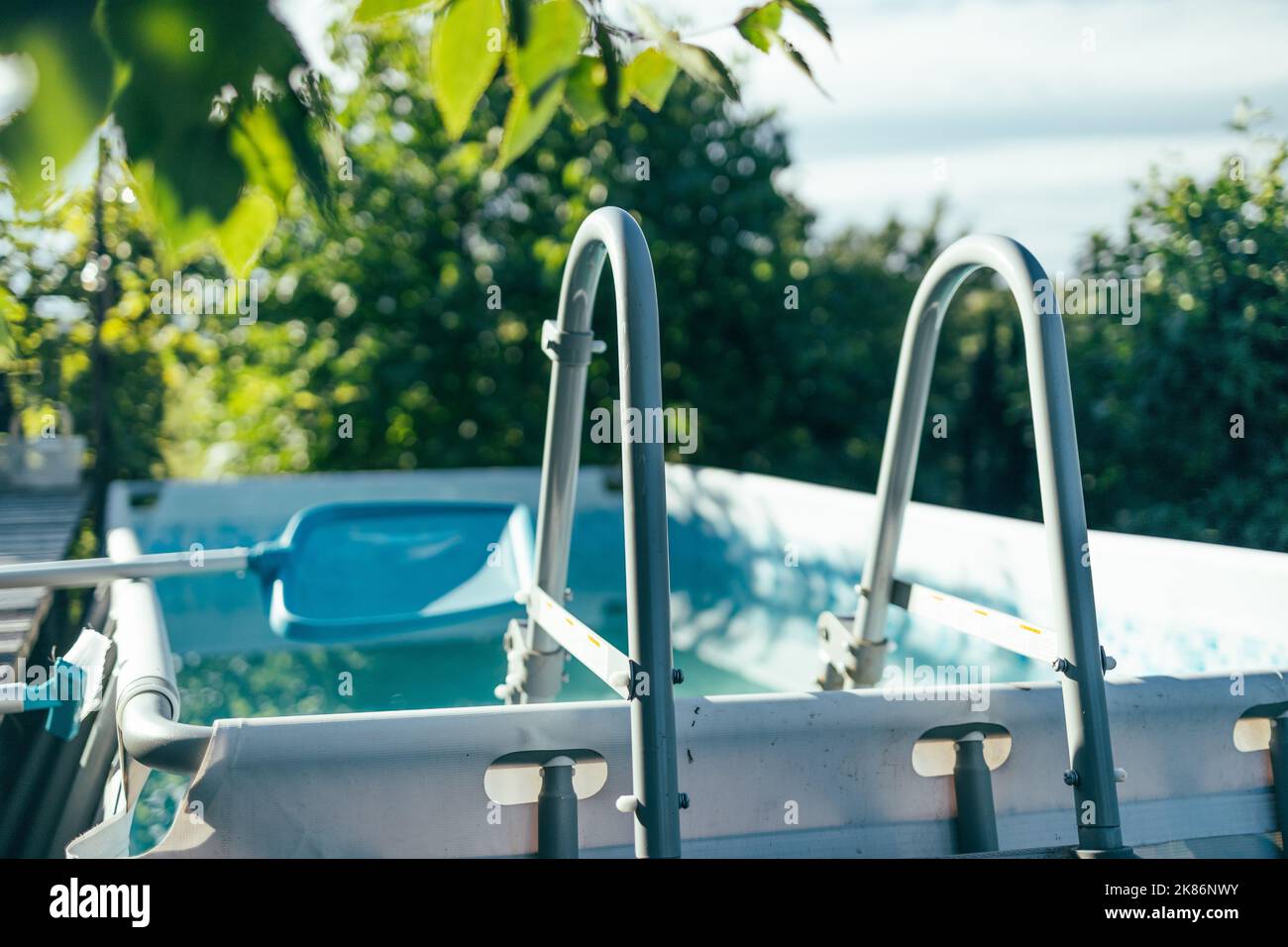 Railing stairs down to the pool. Swimming pool entrance in the summer ...