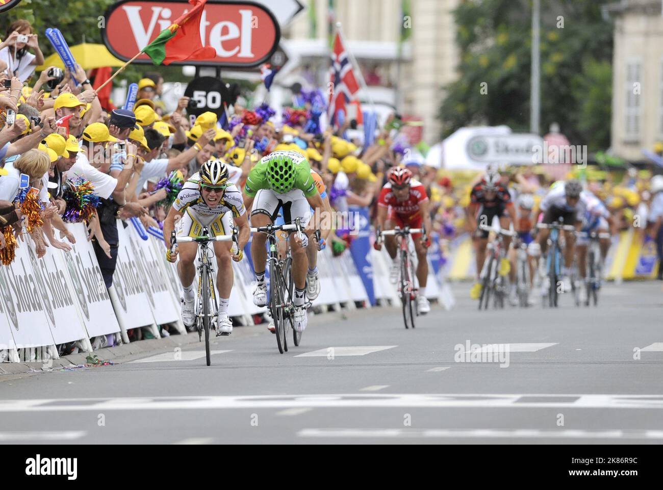 Mark Cavendish riding over the finish line in Issoudun to win the 10th ...