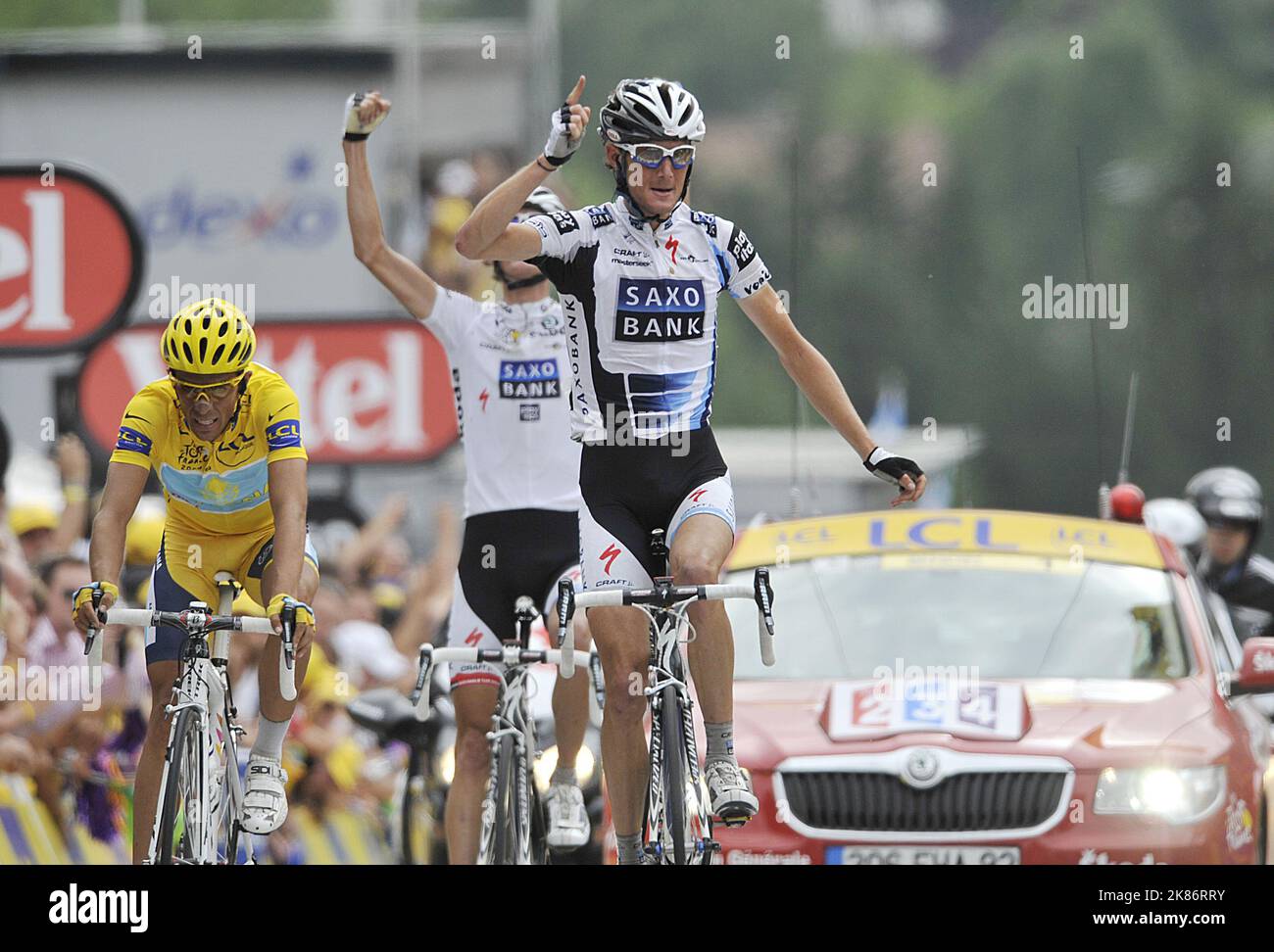 Frank Schleck crosses the finish line to win the stage ahead of his ...