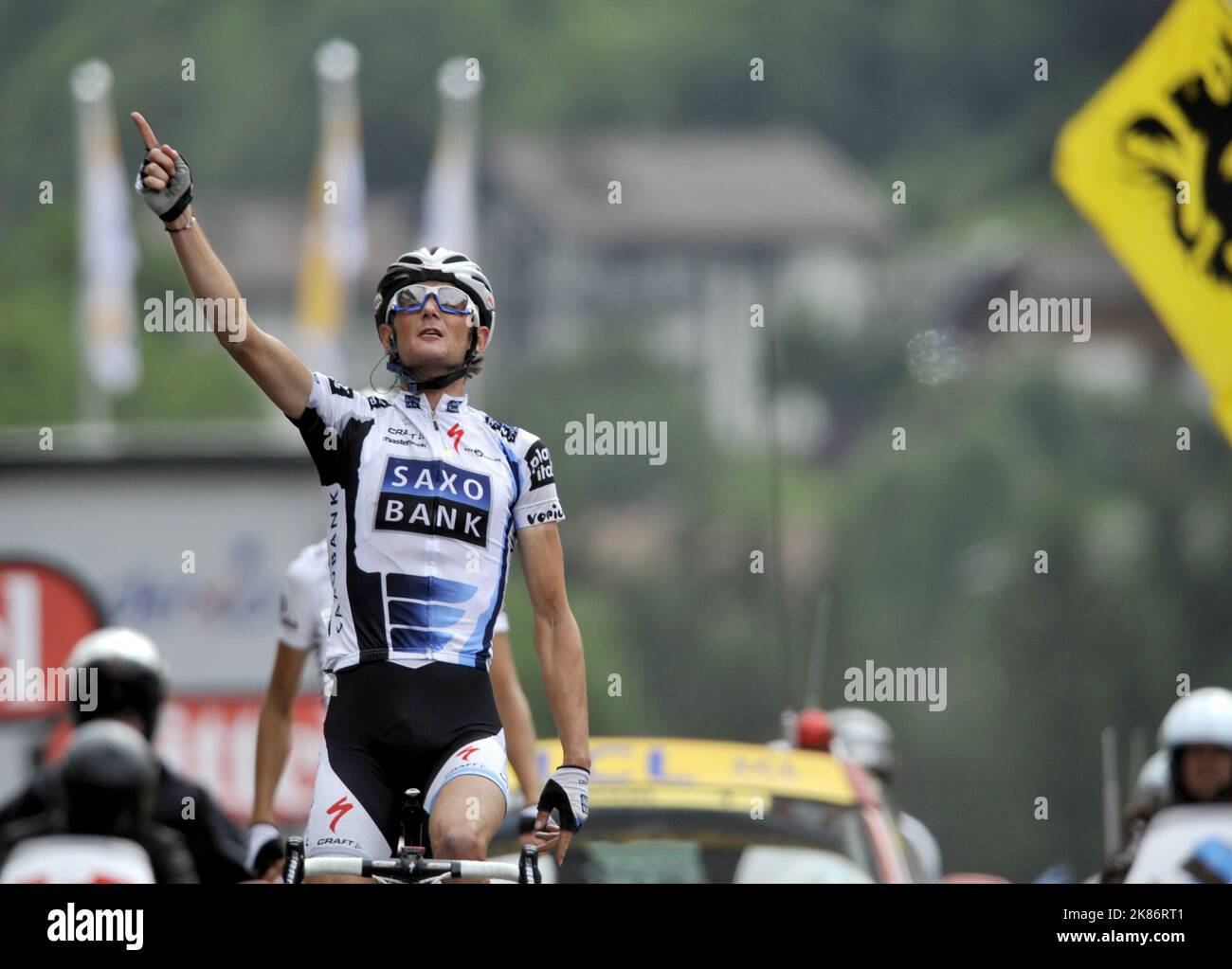 Frank Schleck crosses the finish line to win the stage ahead of his ...