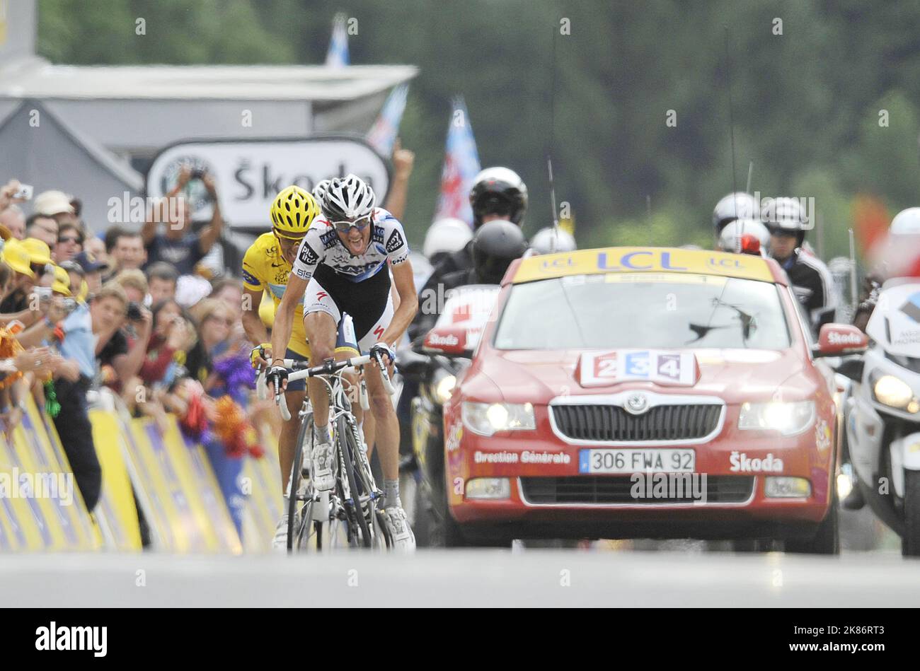 Frank Schleck crosses the finish line to win the stage ahead of his ...