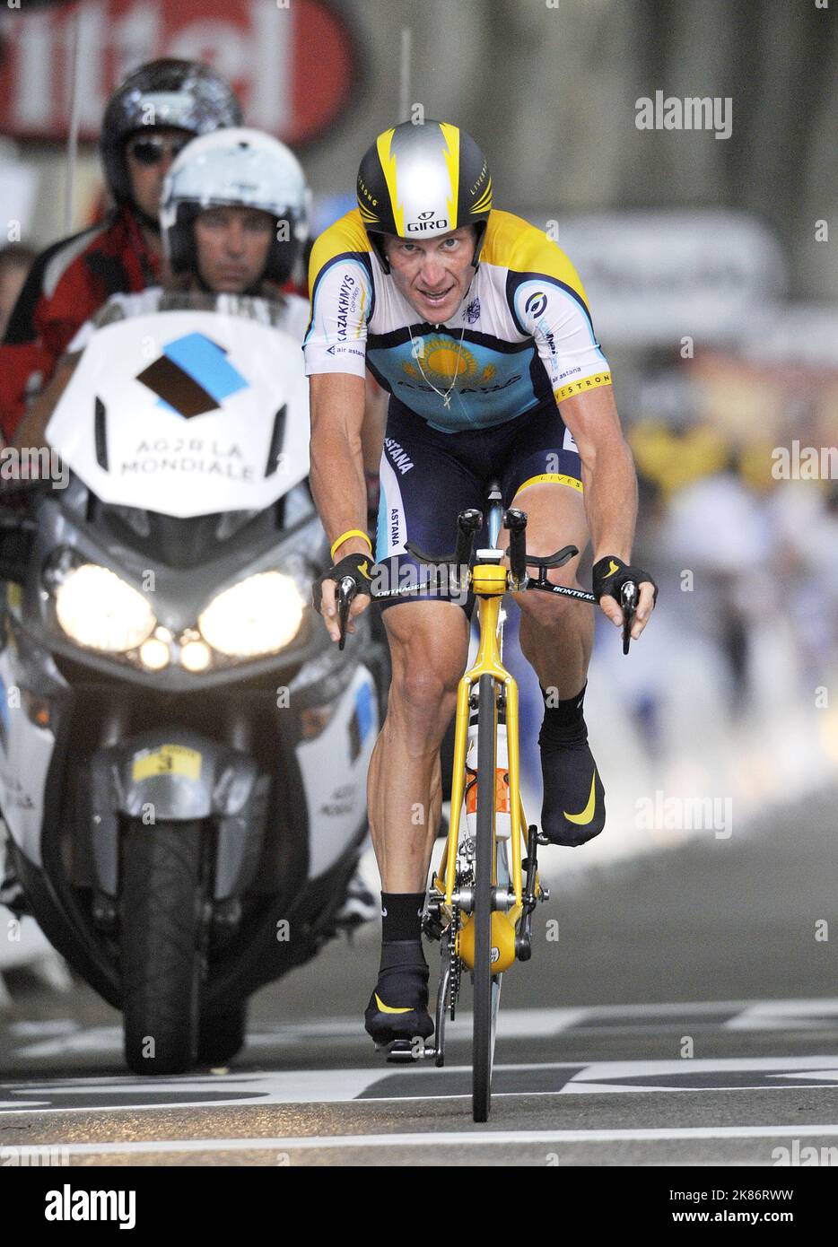 Lance Armstrong crosses the finish line in Annecy to finish 16th and ...