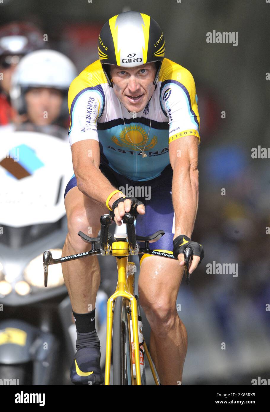 Lance Armstrong crosses the finish line in Annecy to finish 16th and ...