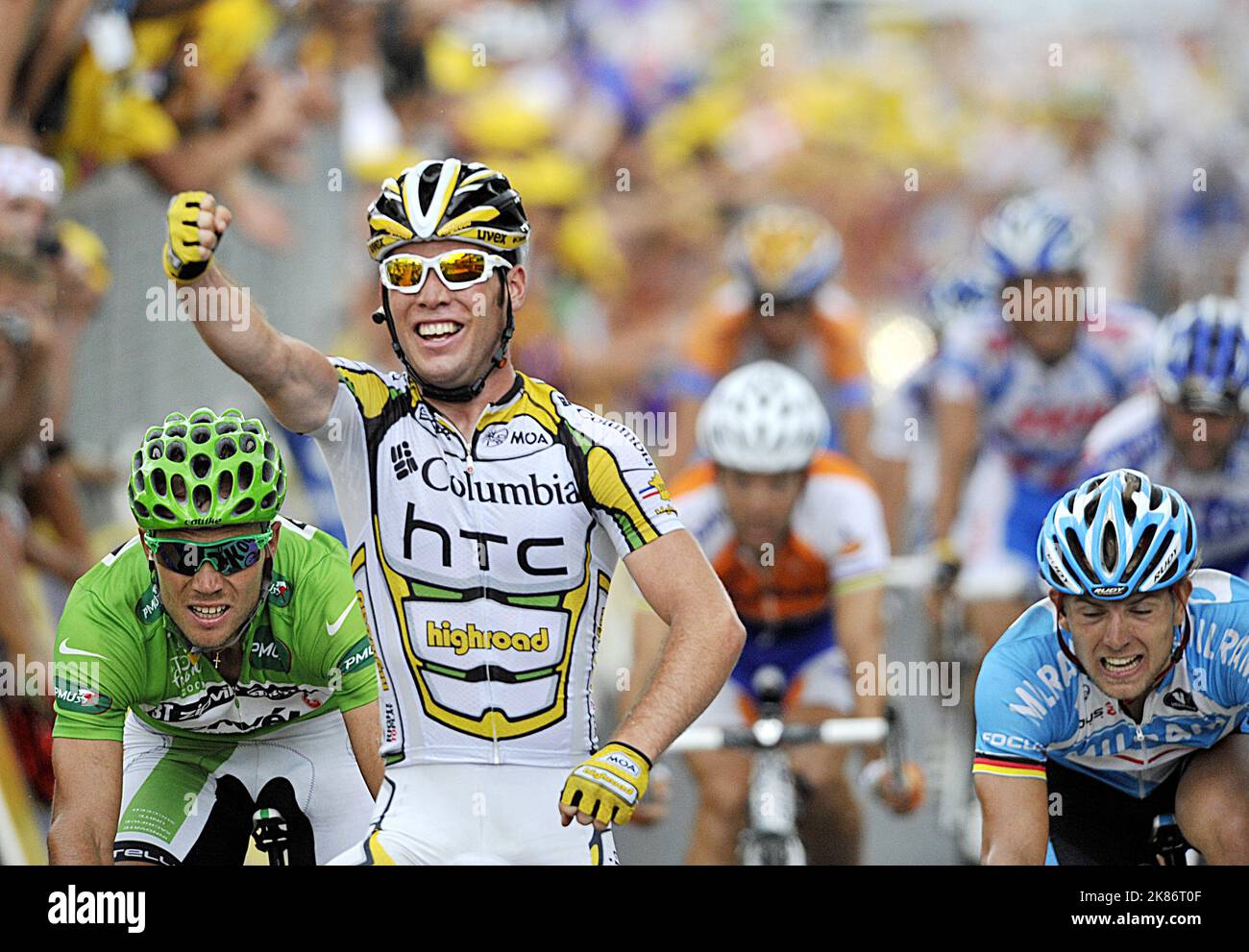 Mark Cavendish celebrates as he crosses the finish line to win his 5th ...