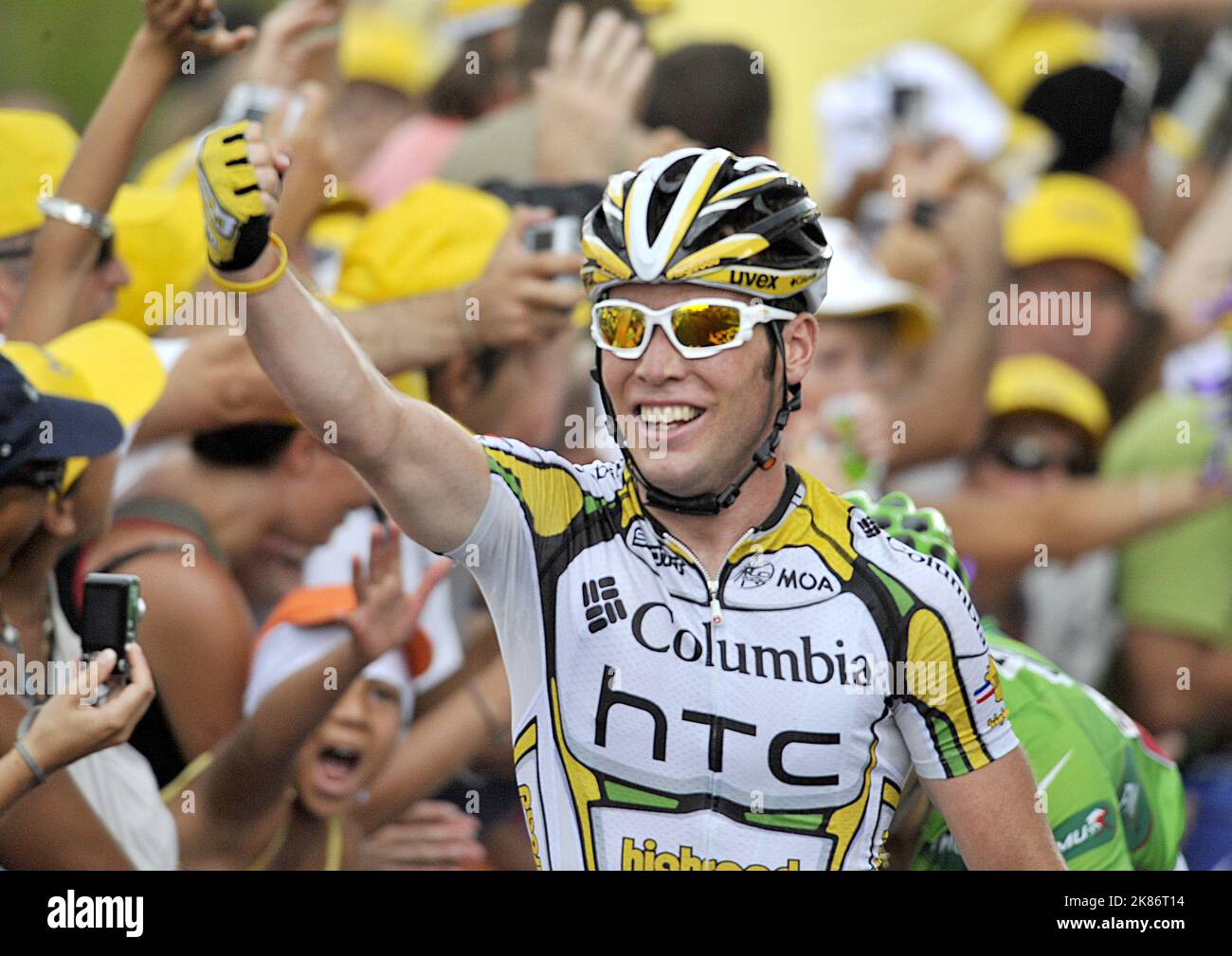 Mark Cavendish celebrates as he crosses the finish line to win his 5th ...