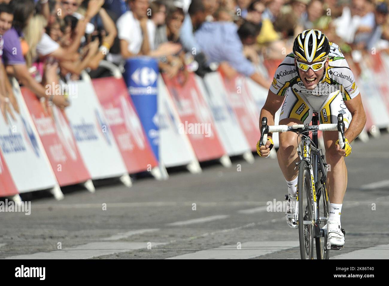 Columbia's Mark Cavendish crosses the line to win the twenty first and ...