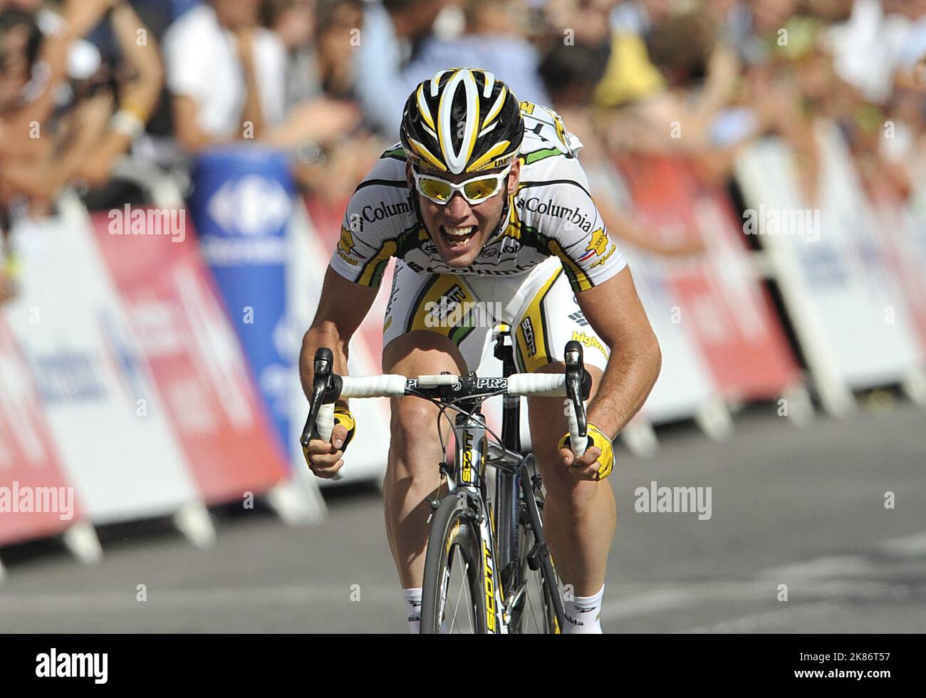 Columbia's Mark Cavendish crosses the line to win the twenty first and ...